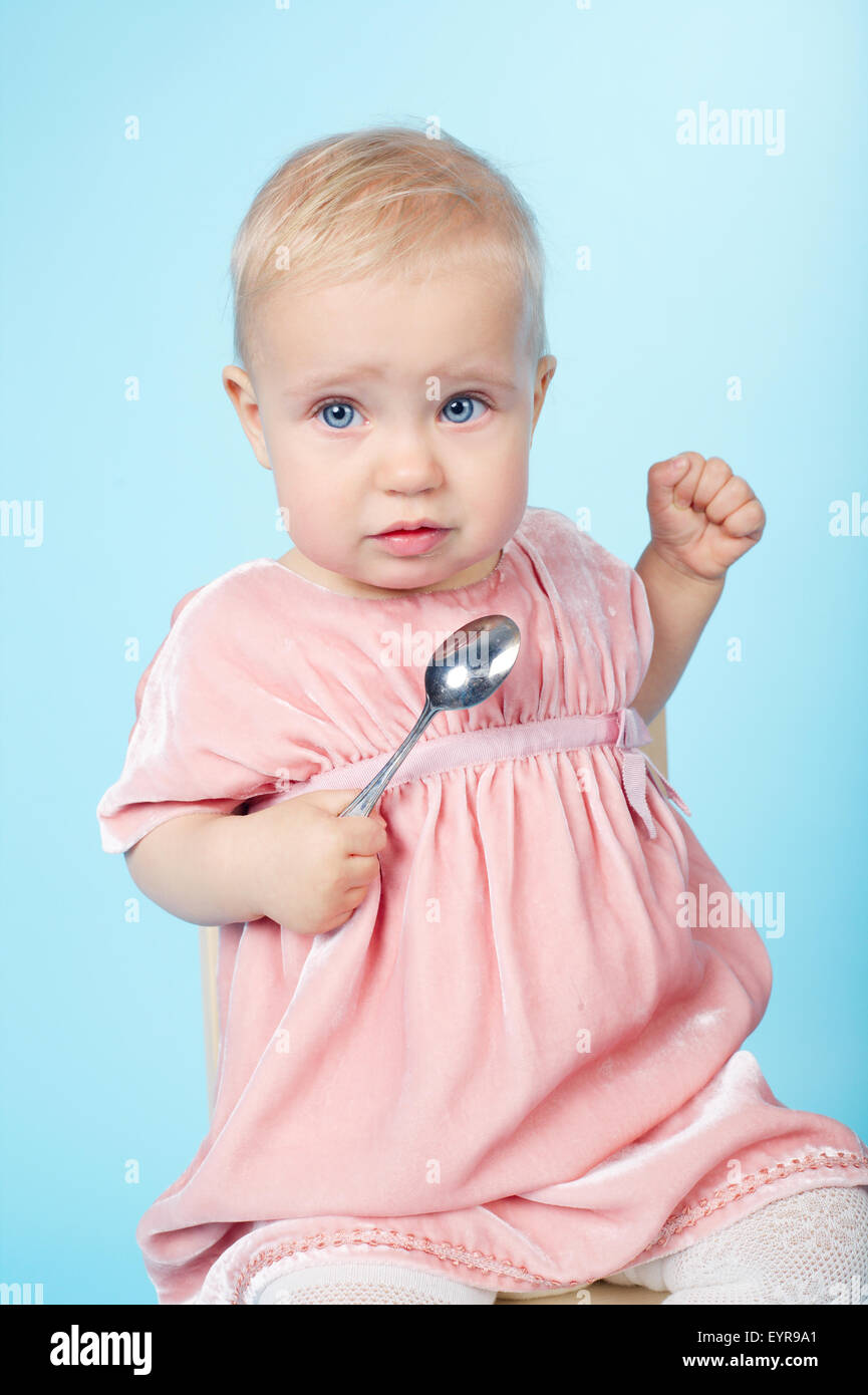 Little child spoon eating hi-res stock photography and images - Alamy