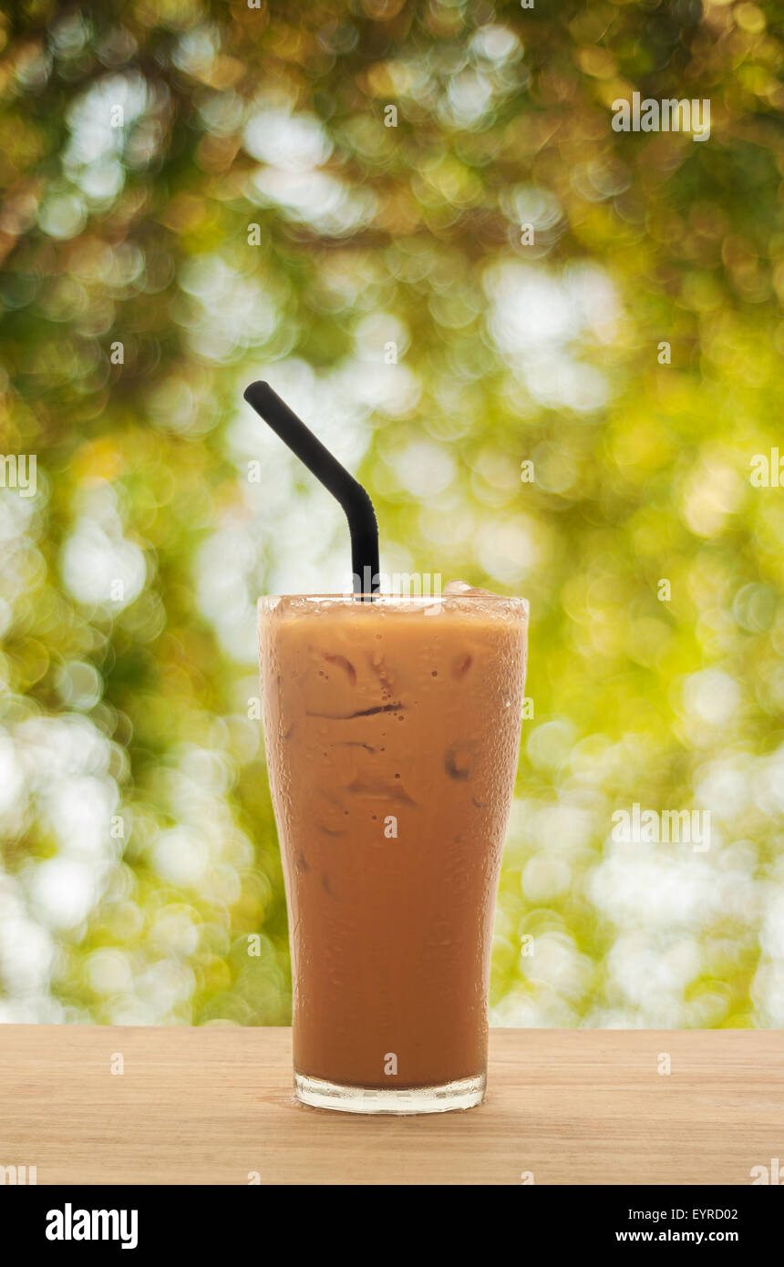 Ice milk tea on wood with spring morning light background Stock Photo ...