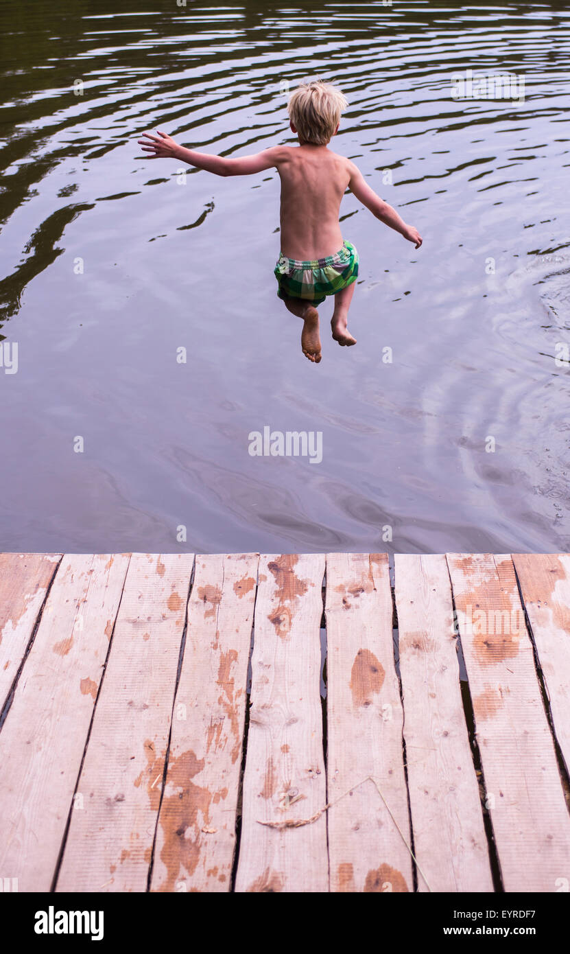 Child diving off pier hi-res stock photography and images - Alamy