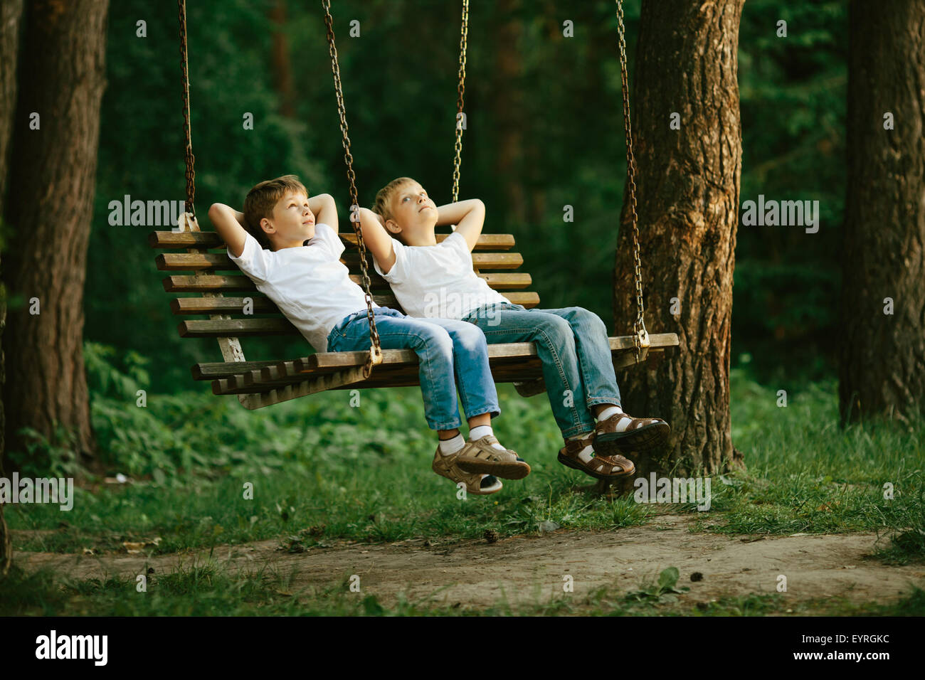 Two Boys Playing On Swings High Resolution Stock Photography and Images ...