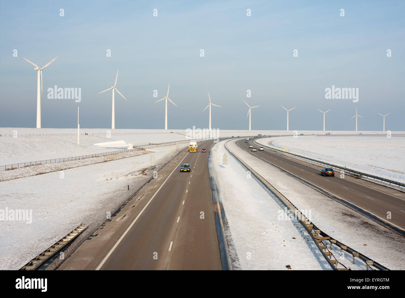 Dutch highway in wintertime with a row of wind turbines behind it Stock ...