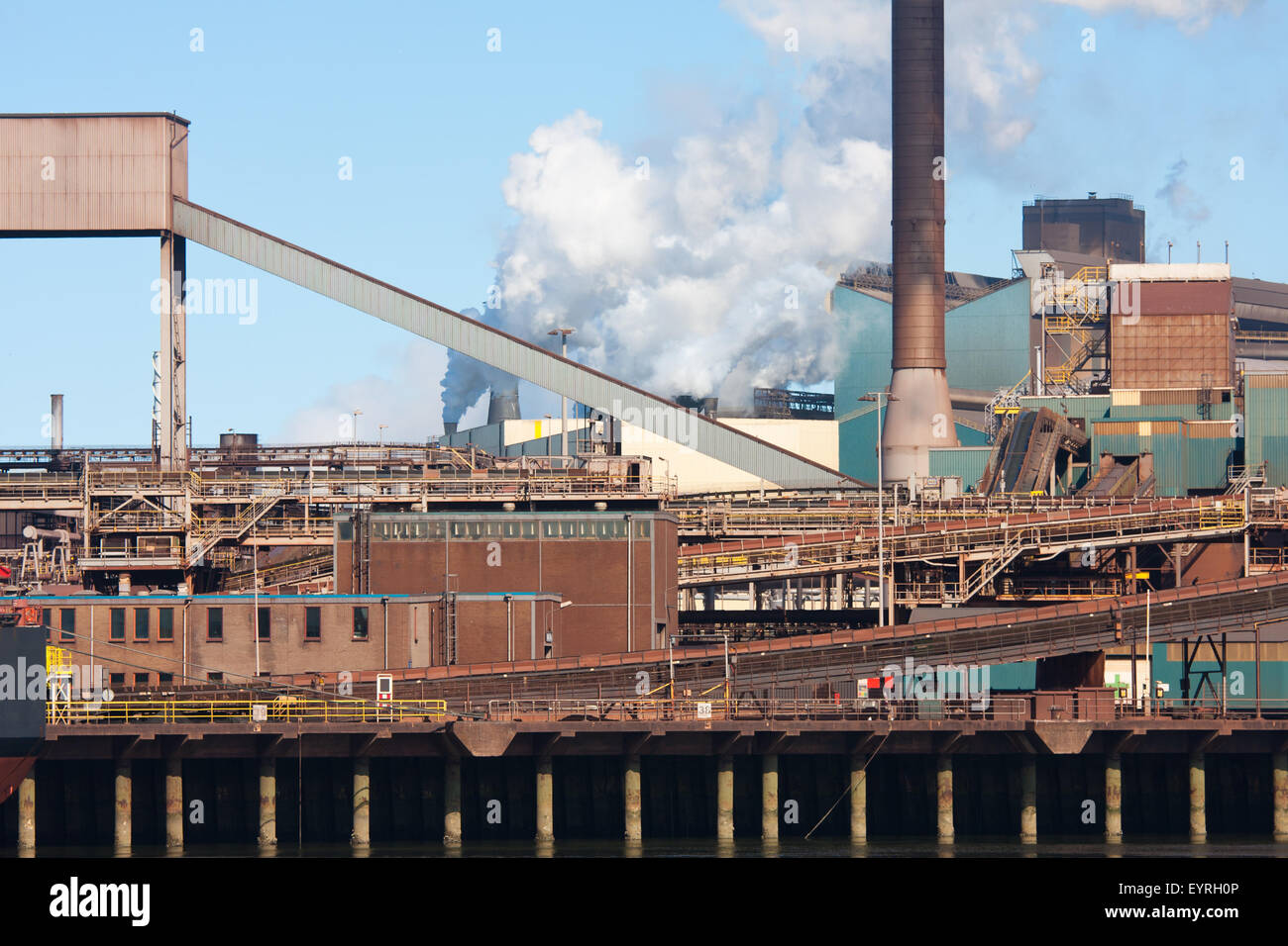Steel factory with smokestacks Stock Photo - Alamy