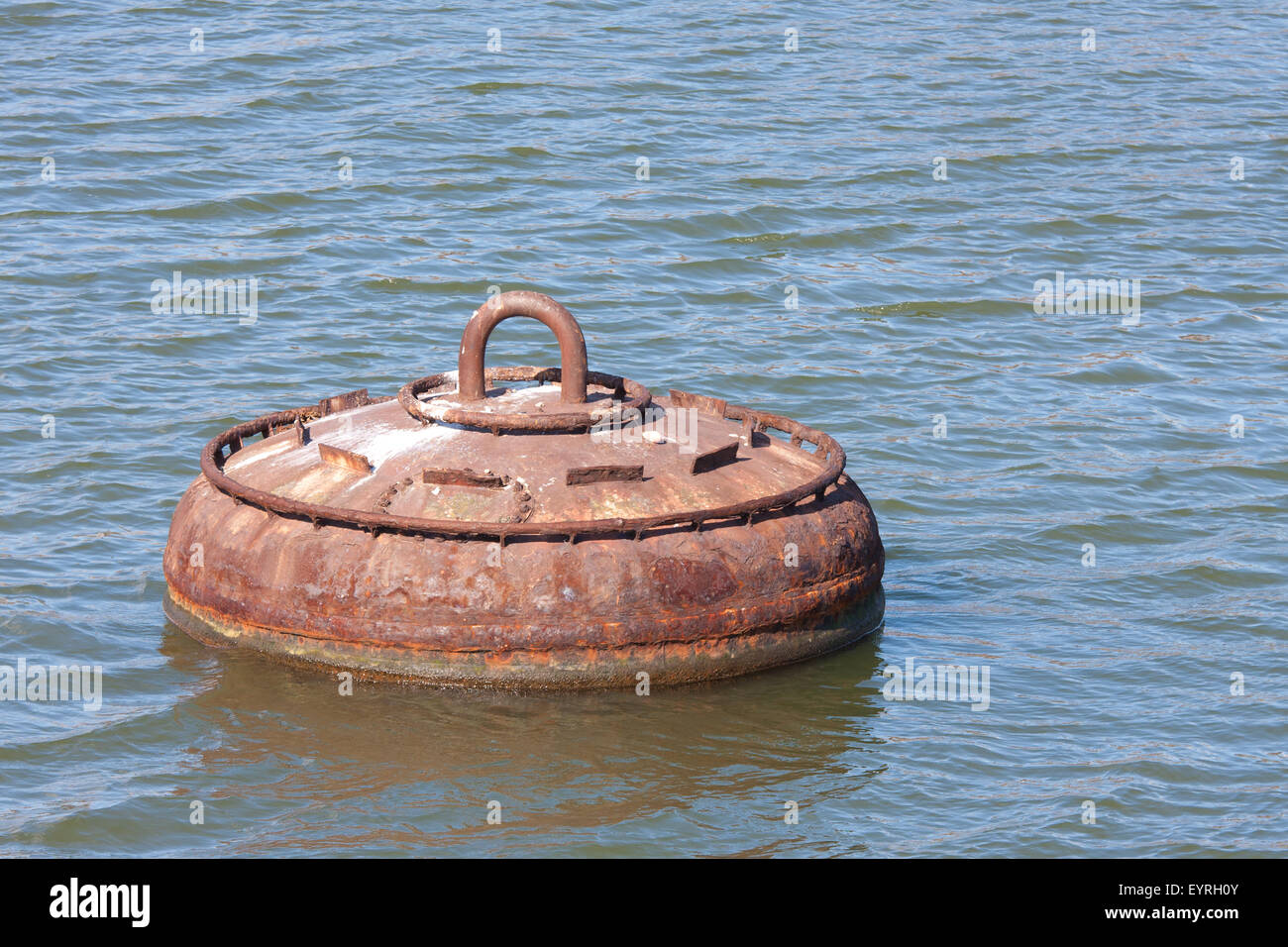 Big rusty buoy for the mooring of ships Stock Photo - Alamy