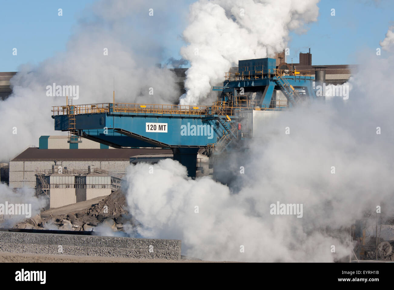 Portal Crane with many clouds of steam in a Dutch steel factory Stock ...