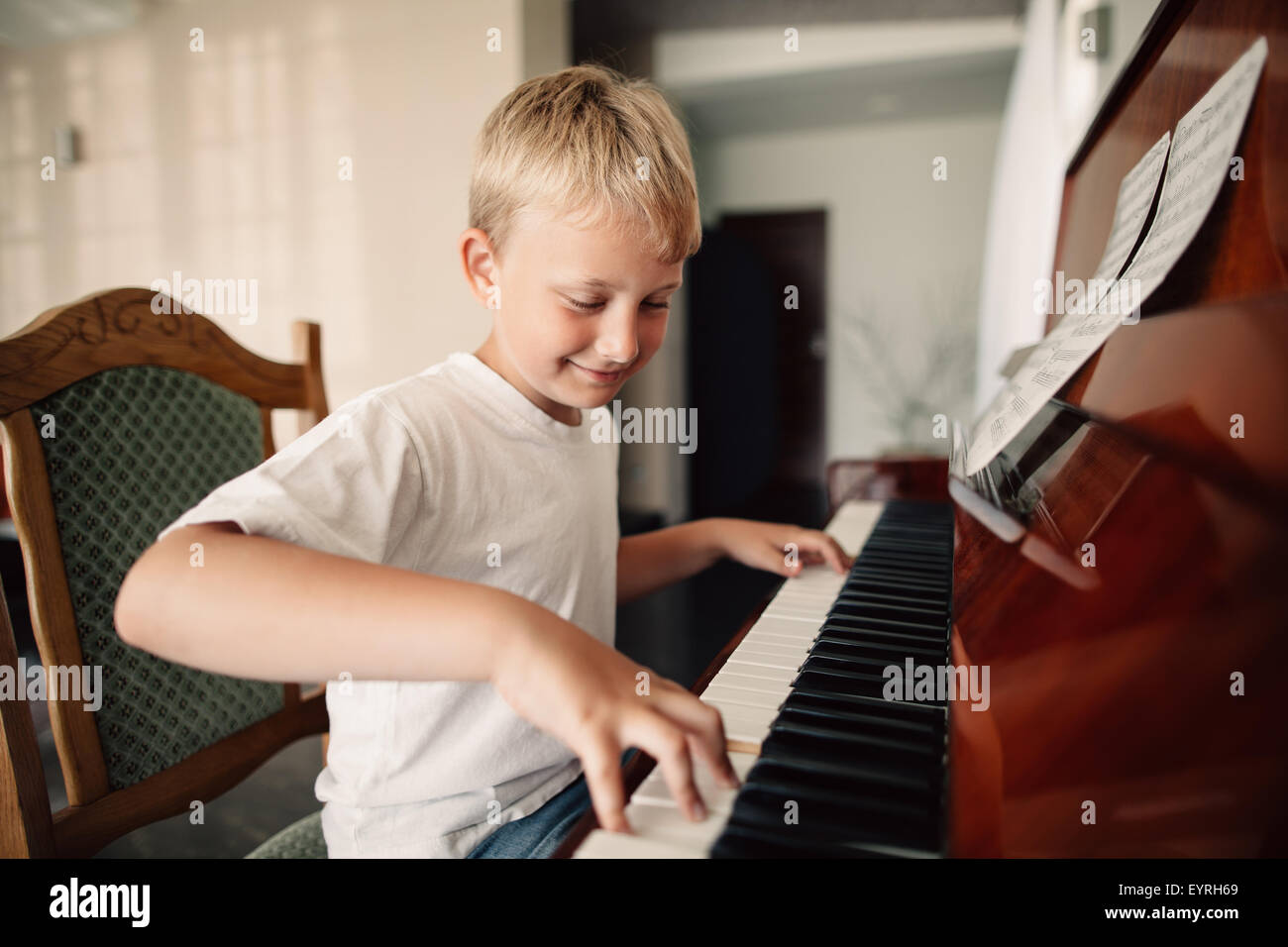 Boy piano hi-res stock photography and images - Alamy