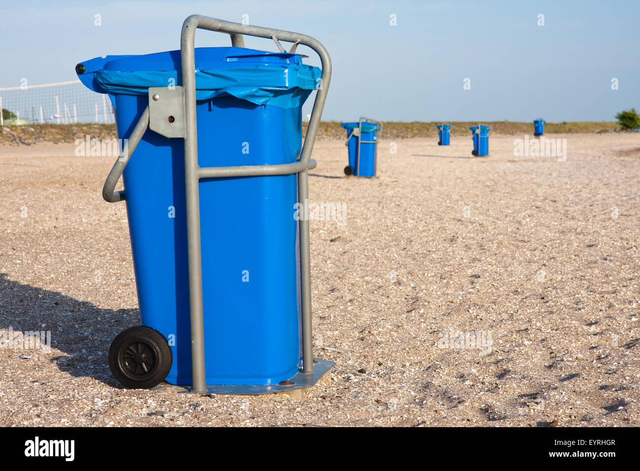 Big blue dust bins at the beach Stock Photo - Alamy