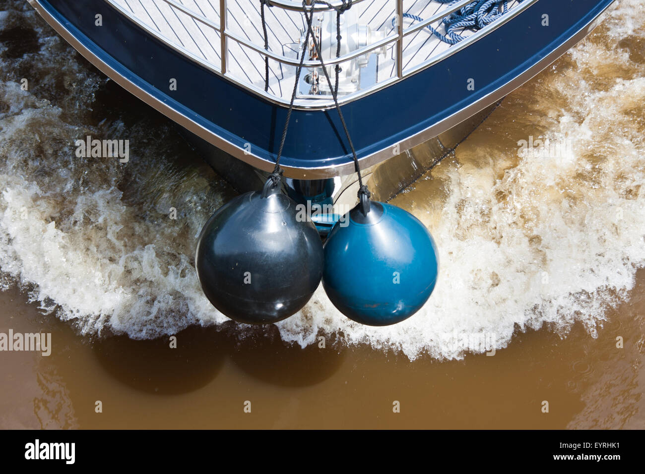 Front view of sailing yacht wit a bow wave and fenders around Stock ...