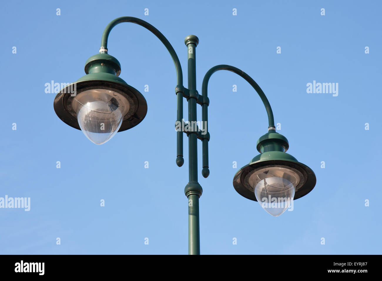 Modern green double lamppost Stock Photo - Alamy
