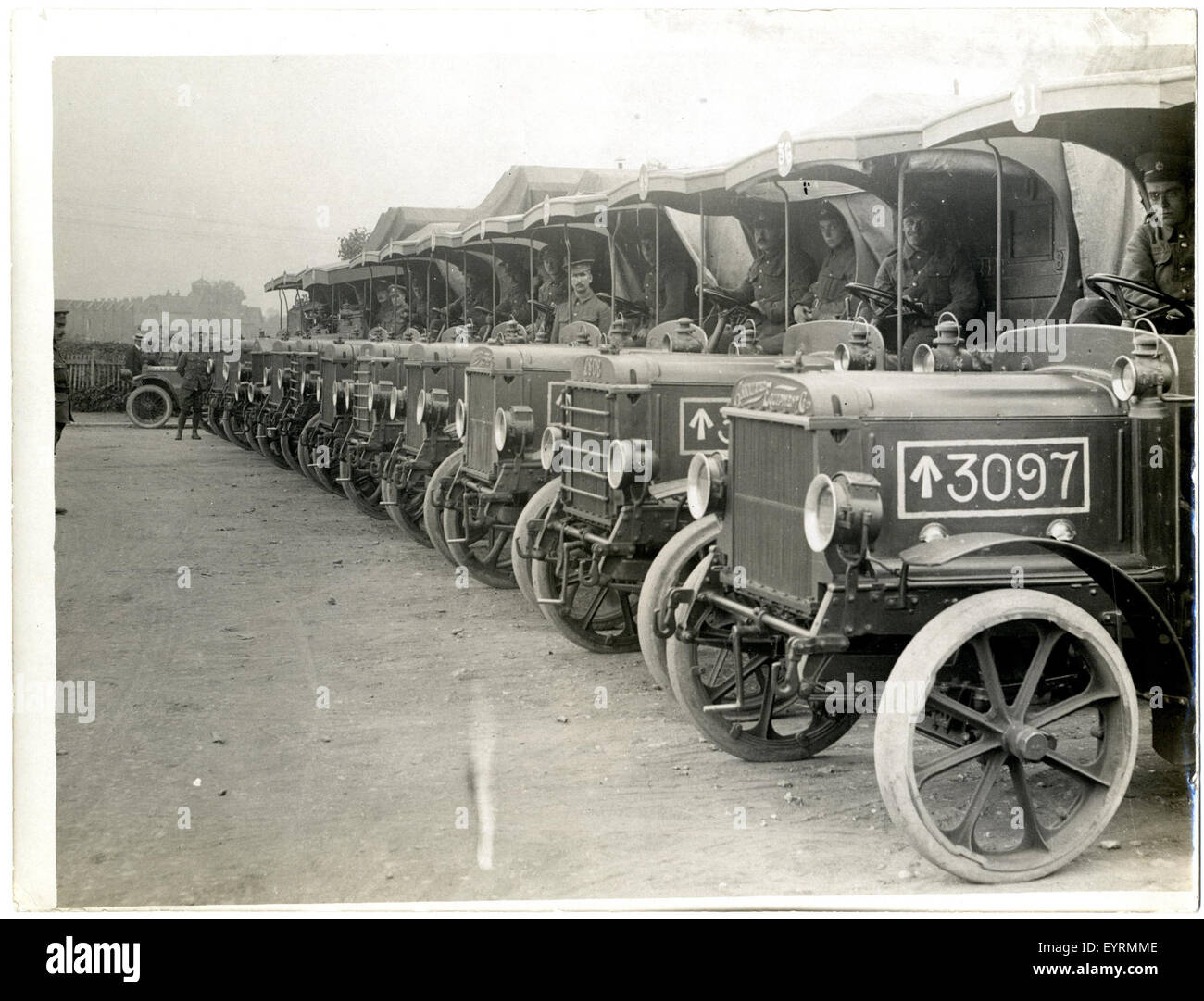 A photograph depicting a supply column waiting to load at a railway ...