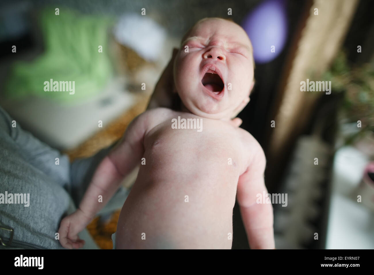 mother holds crying baby in hands Stock Photo - Alamy