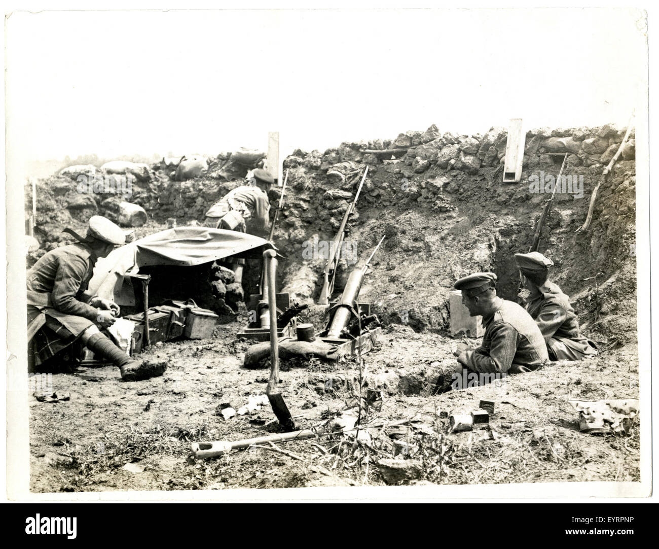 This photograph depicts a bomb gun section during World War I, possibly ...