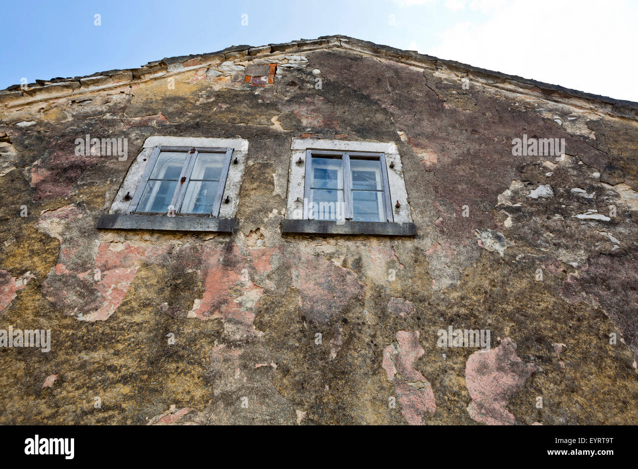 Dilapidated gable wall with two windows Stock Photo - Alamy