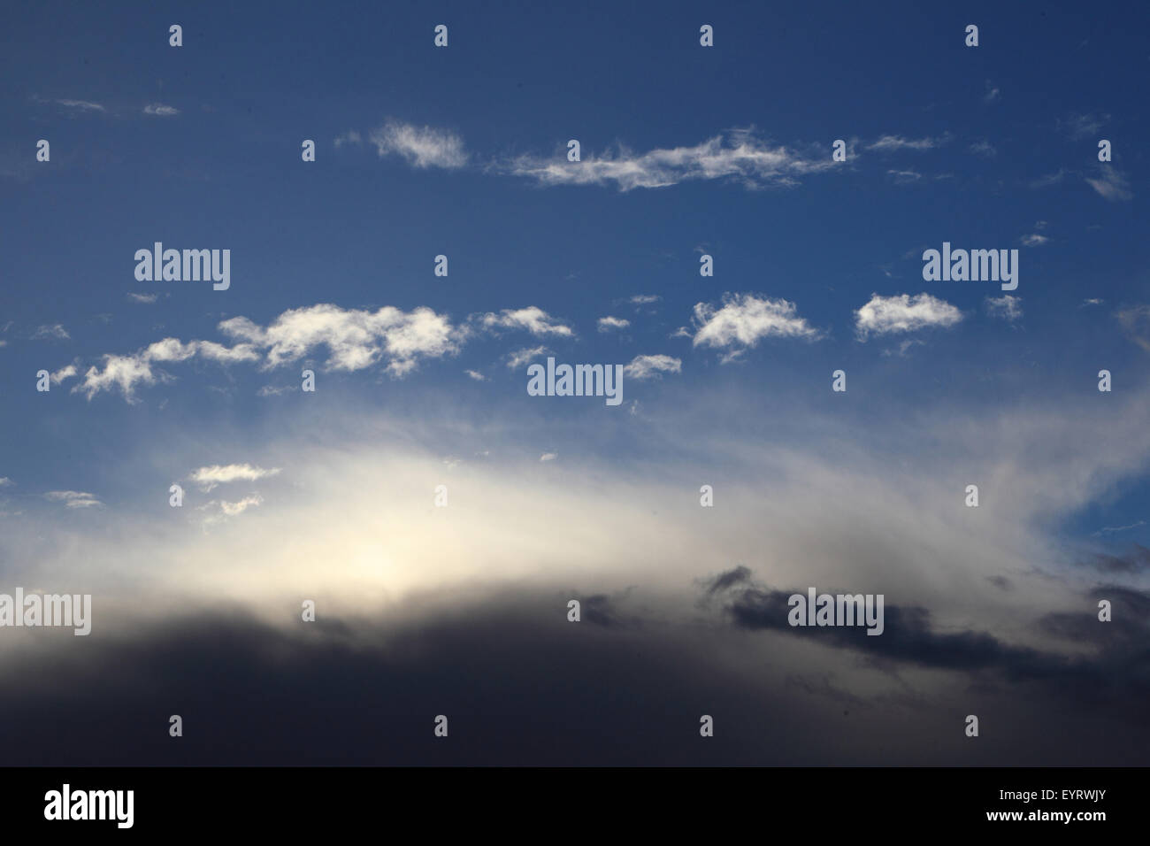 The sun behind clouds Stock Photo - Alamy