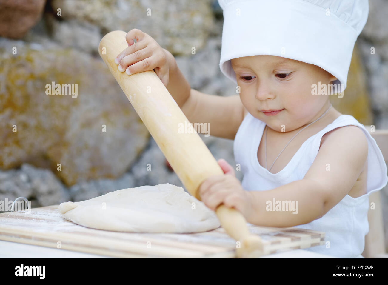 little boy with chef hat cooking Stock Photo - Alamy