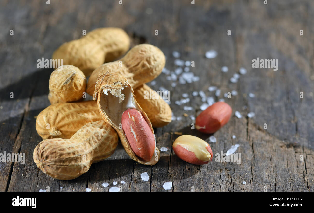 peanut and salt isolated on wooden background Stock Photo - Alamy