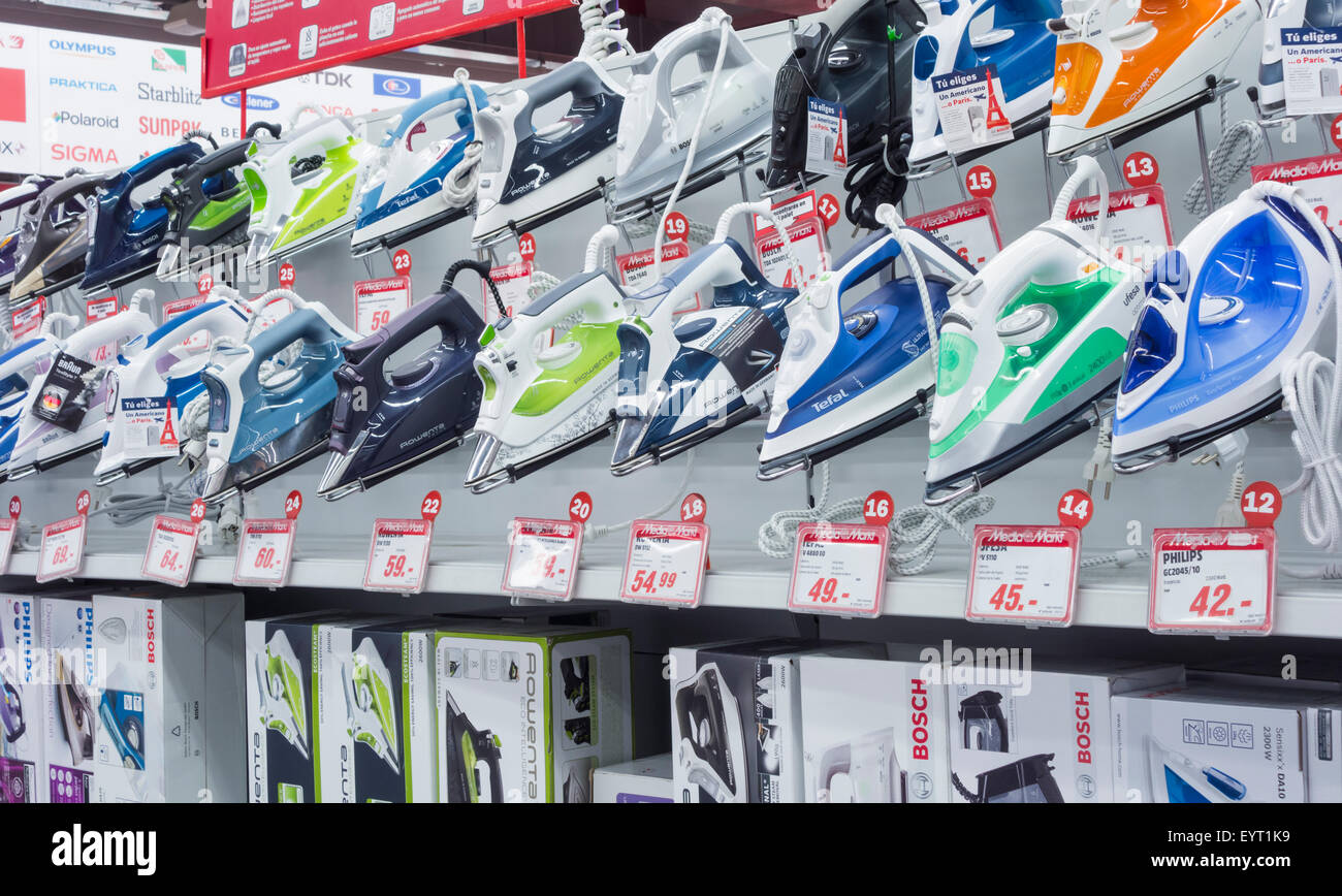 Irons on display in electrical goods store in Spain Stock Photo - Alamy
