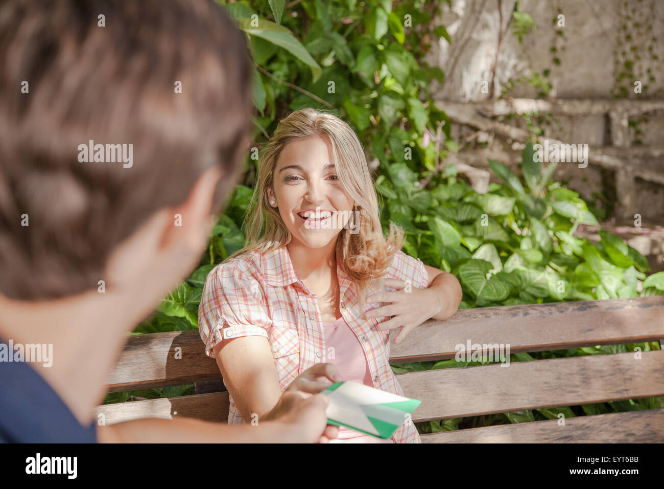 Man giving to a woman a letter Stock Photo - Alamy