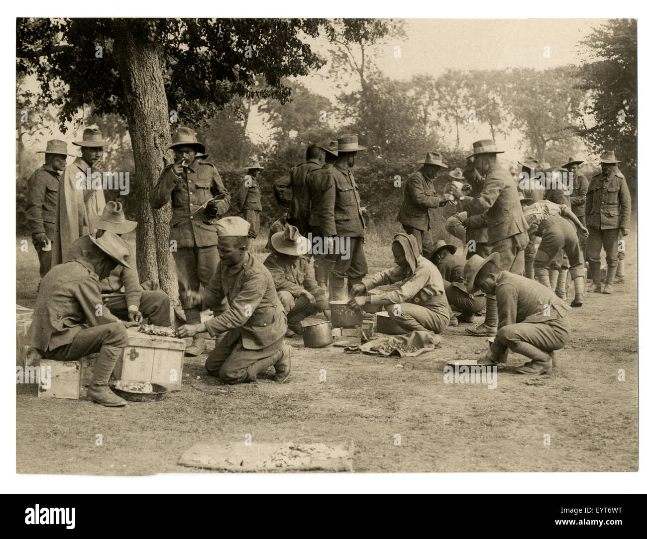 A photograph showing Gurkhas preparing and cooking food in St. Floris ...