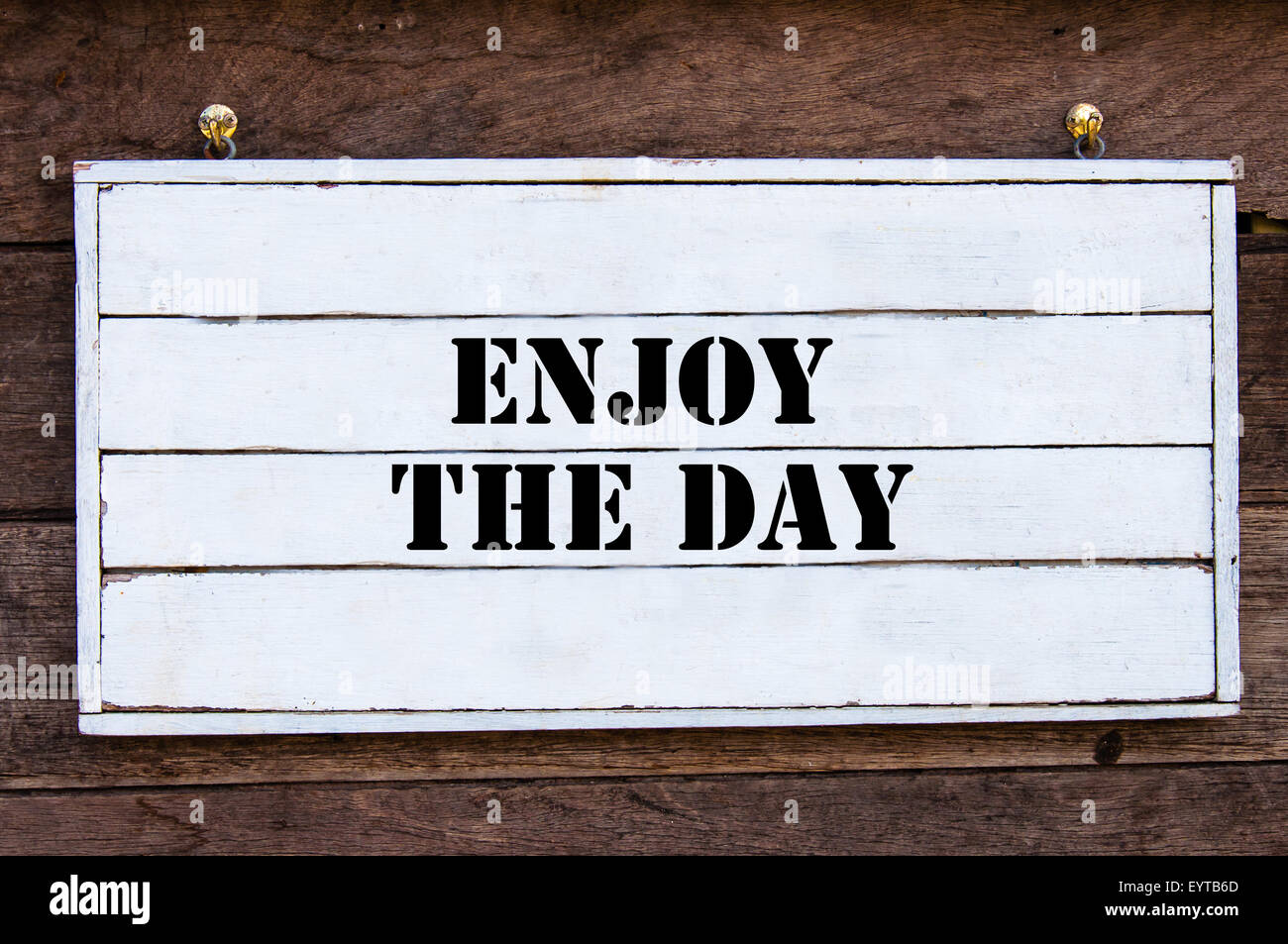 Enjoy The Day Inspirational message written on vintage wooden board ...