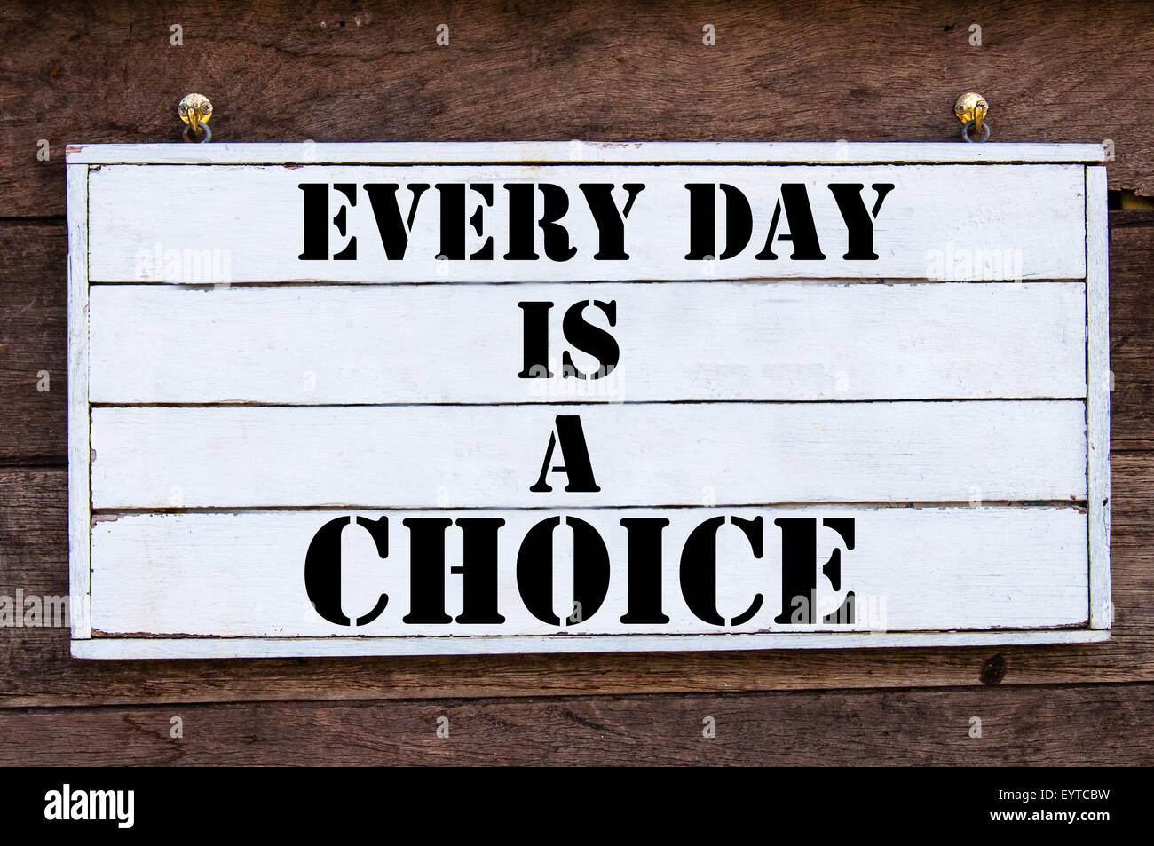 Every Day Is A Choice Inspirational message written on vintage wooden ...