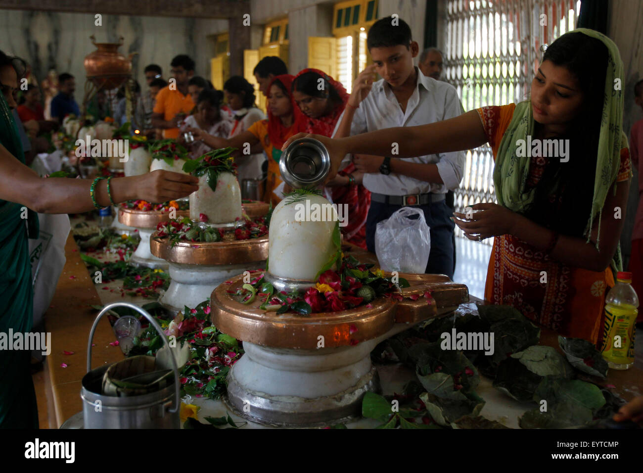 Allahabad, India. 03rd Aug, 2015. Hindu devotees offering milk and ...