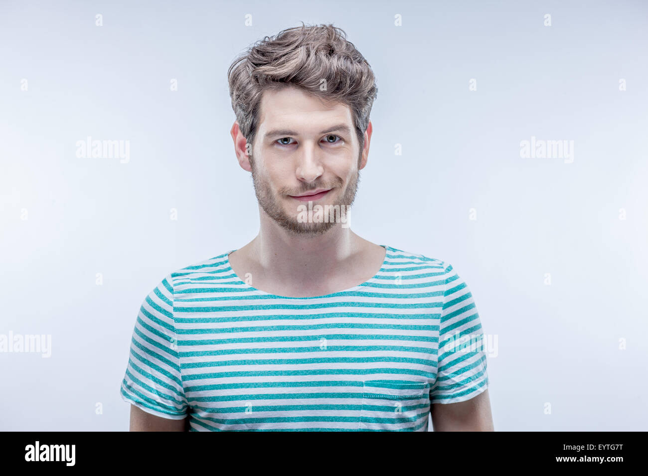Young man looking in the camera Stock Photo - Alamy