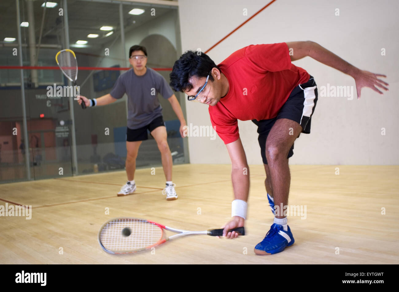 Men playing squash Stock Photo - Alamy