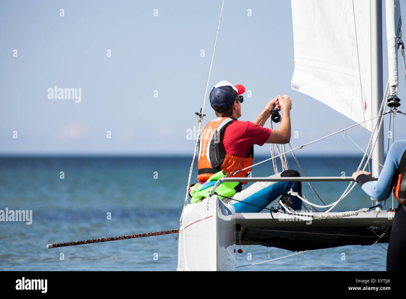 preparations for sailing, sheet hooking into the canvas Stock Photo - Alamy
