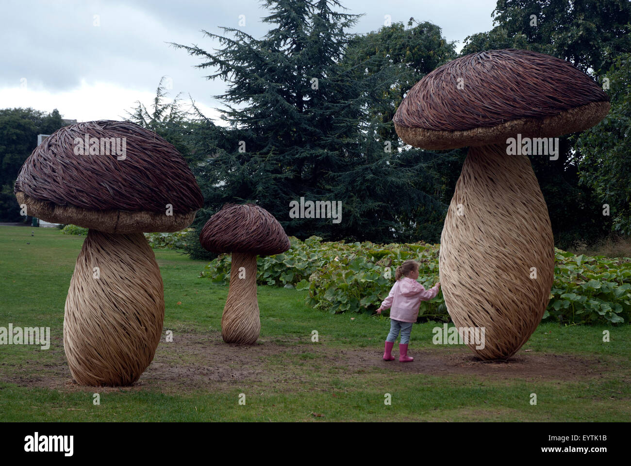 Toadstool and mushroom straw statues, West London Garden England UK ...