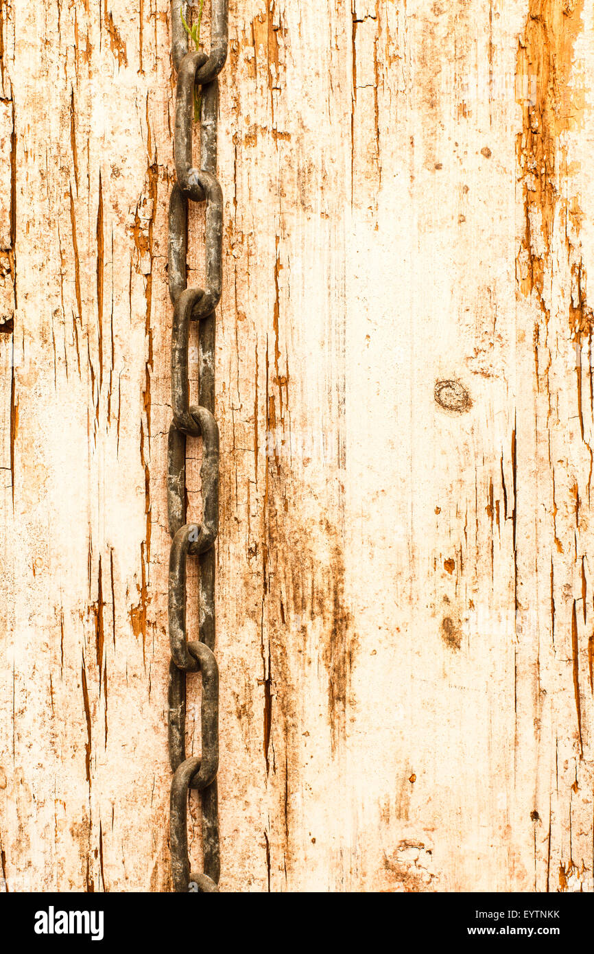 Chain, weathered wooden background Stock Photo - Alamy
