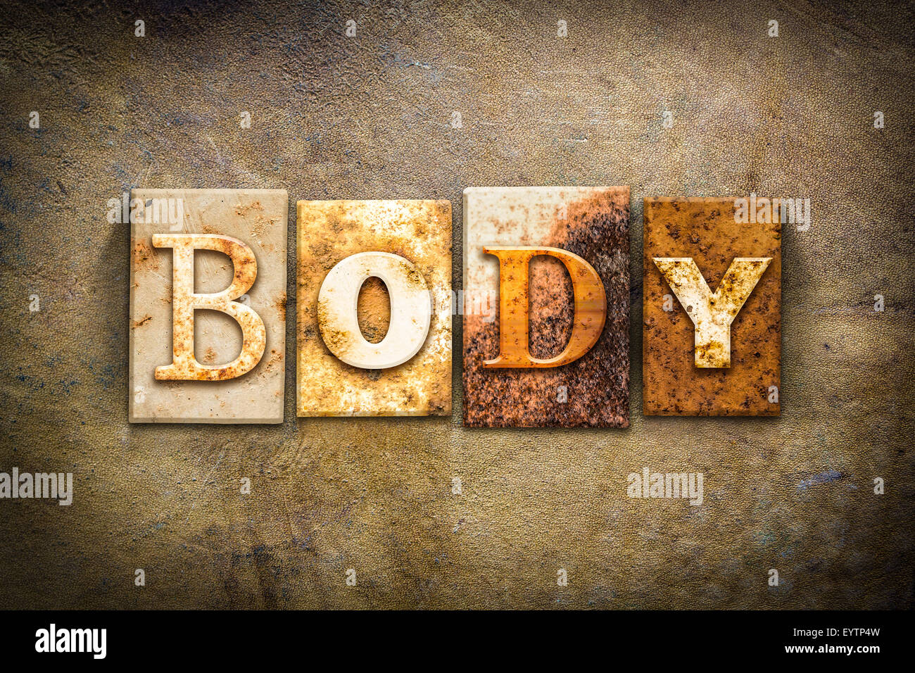 The word "BODY" written in rusty metal letterpress type on an old aged ...