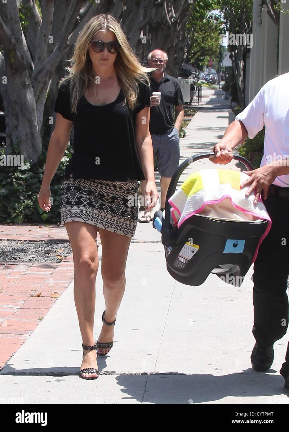 Ali Larter wearing a geometric-patterned black and white mini skirt ...