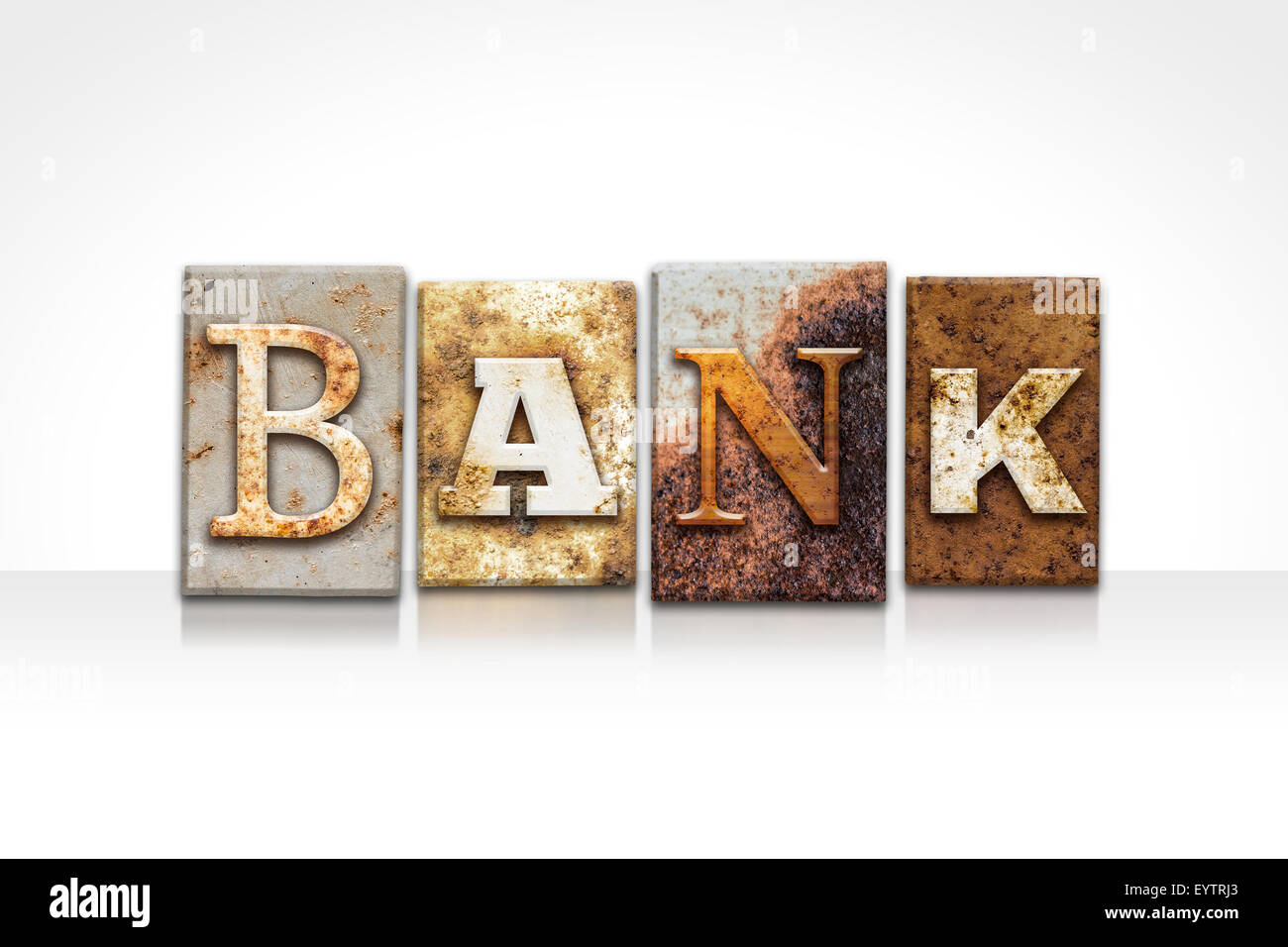 The word "BANK" written in rusty metal letterpress type isolated on a ...