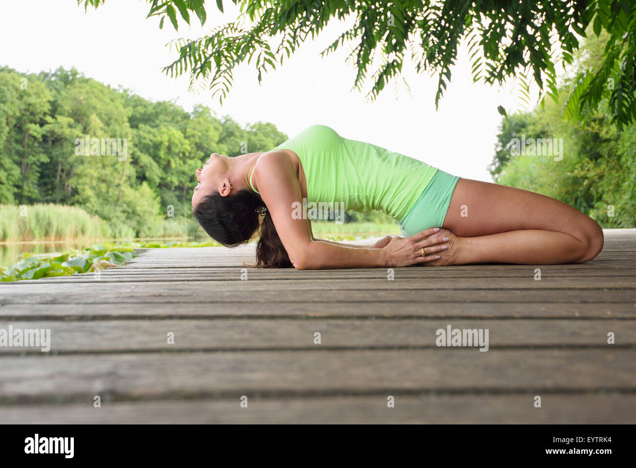 Woman, yoga, meditate, nature, side view Stock Photo - Alamy