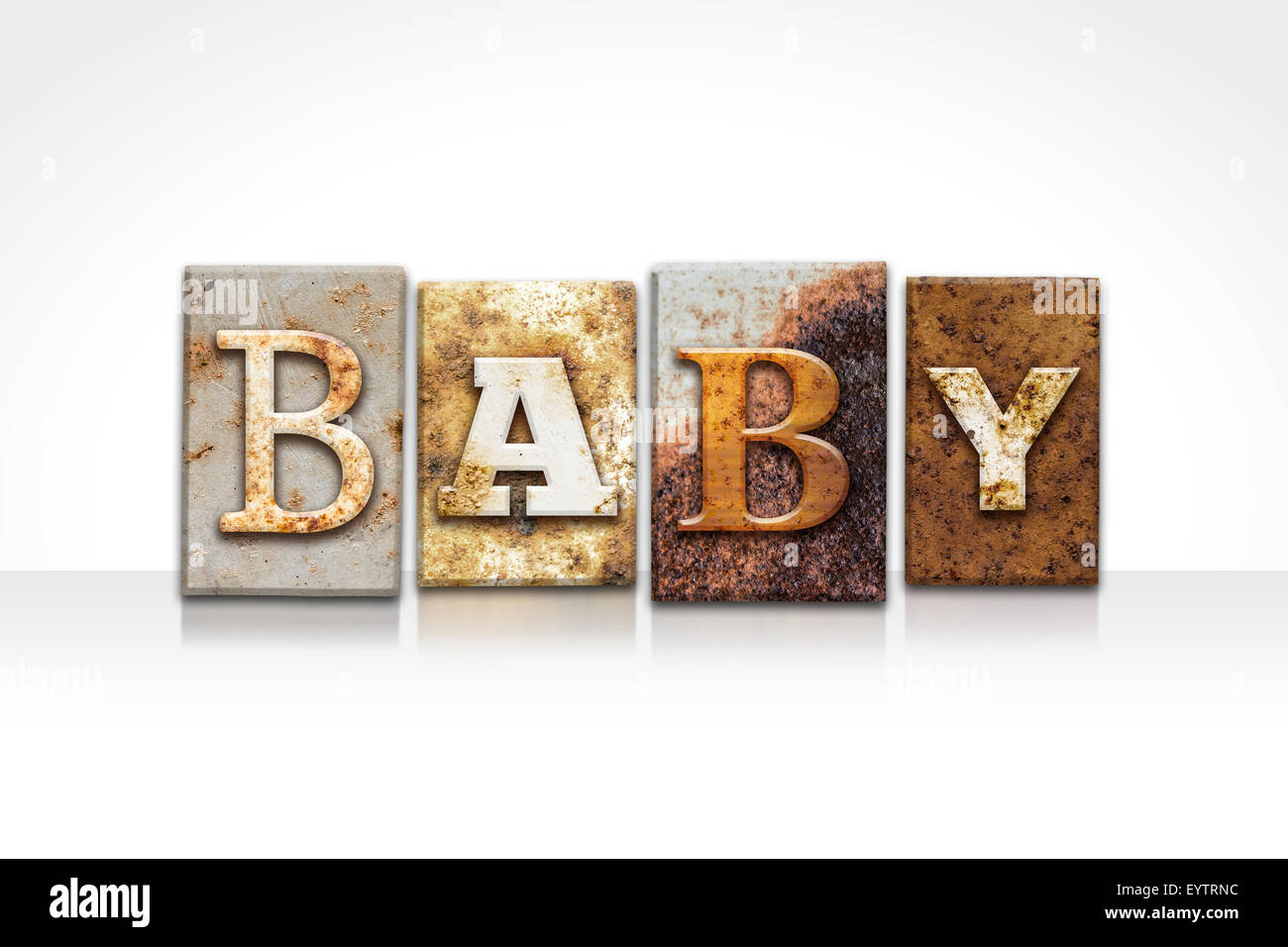 The word "BABY" written in rusty metal letterpress type isolated on a ...