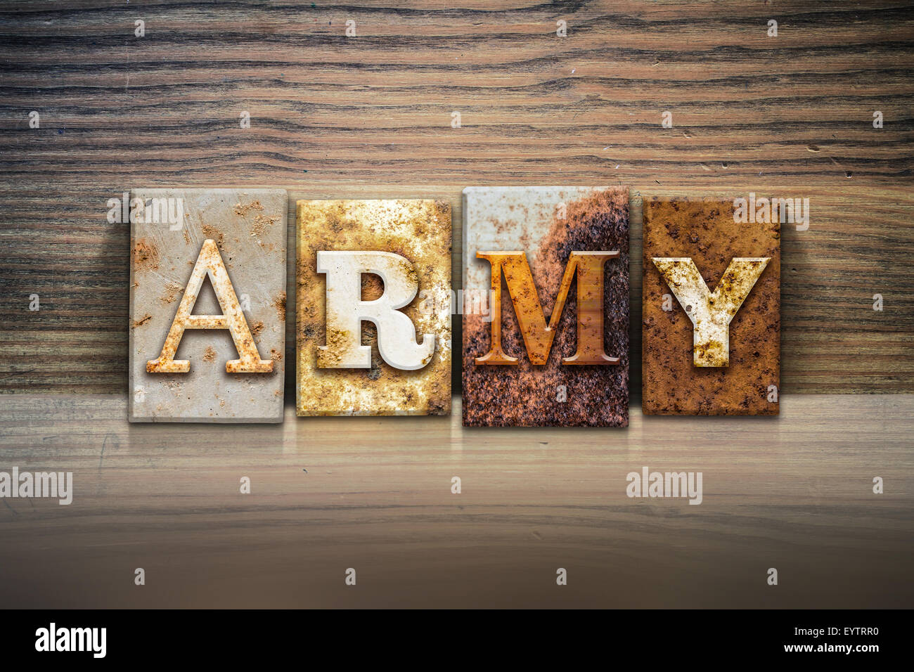 The word "ARMY" written in rusty metal letterpress type sitting on a ...