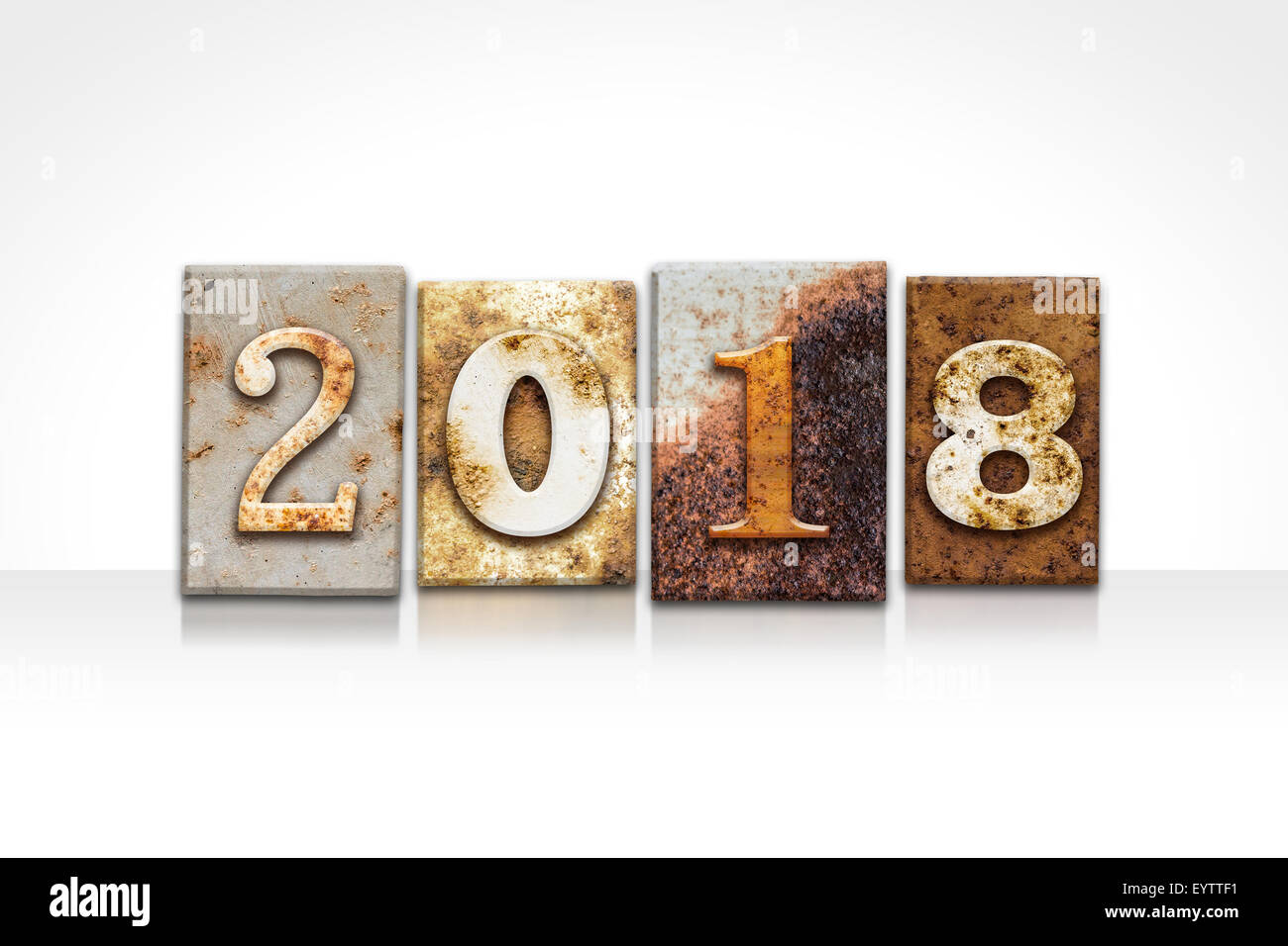 The word "2018" written in rusty metal letterpress type isolated on a ...