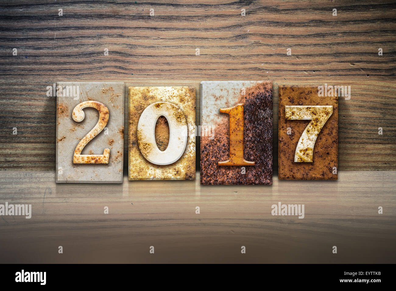 The word "2017" written in rusty metal letterpress type sitting on a ...