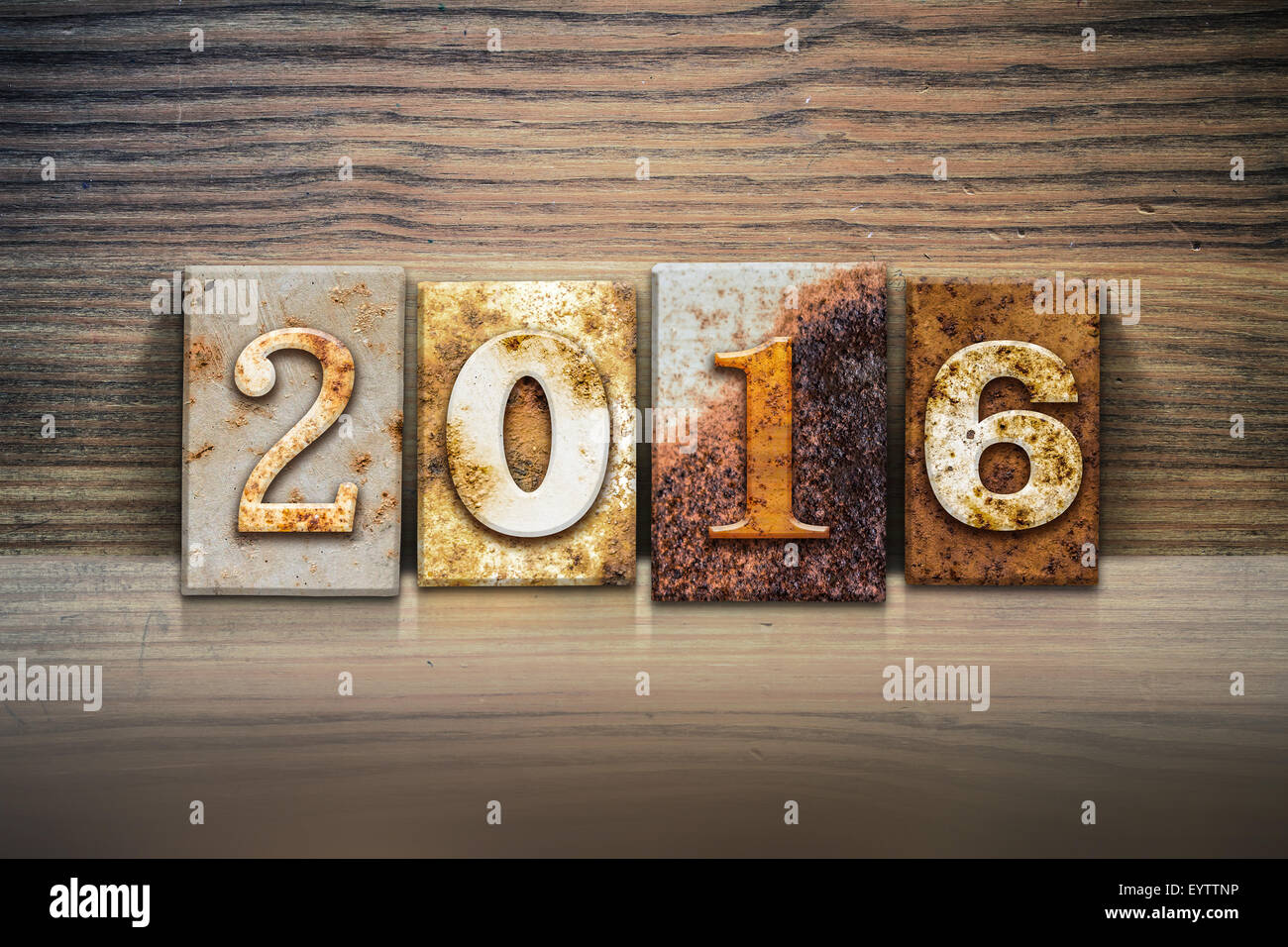 The word "2016" written in rusty metal letterpress type sitting on a ...