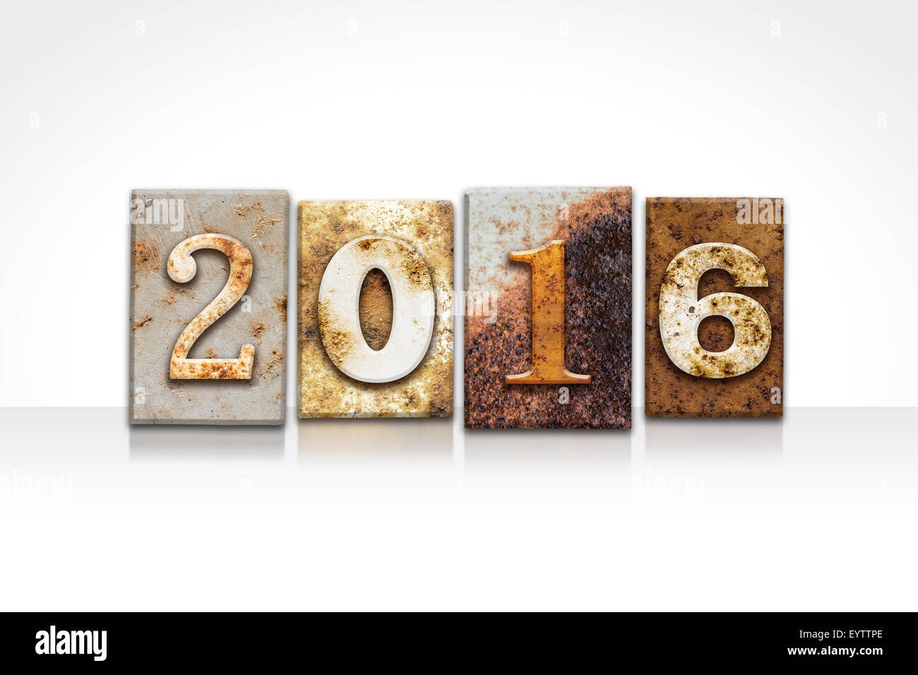 The word "2016" written in rusty metal letterpress type isolated on a ...
