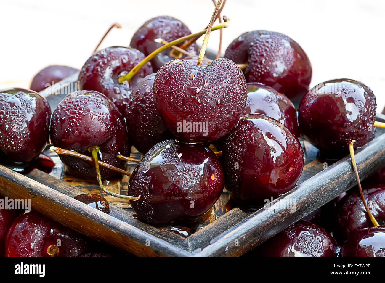 close up of cherry and water droplets clinging to skin Stock Photo - Alamy