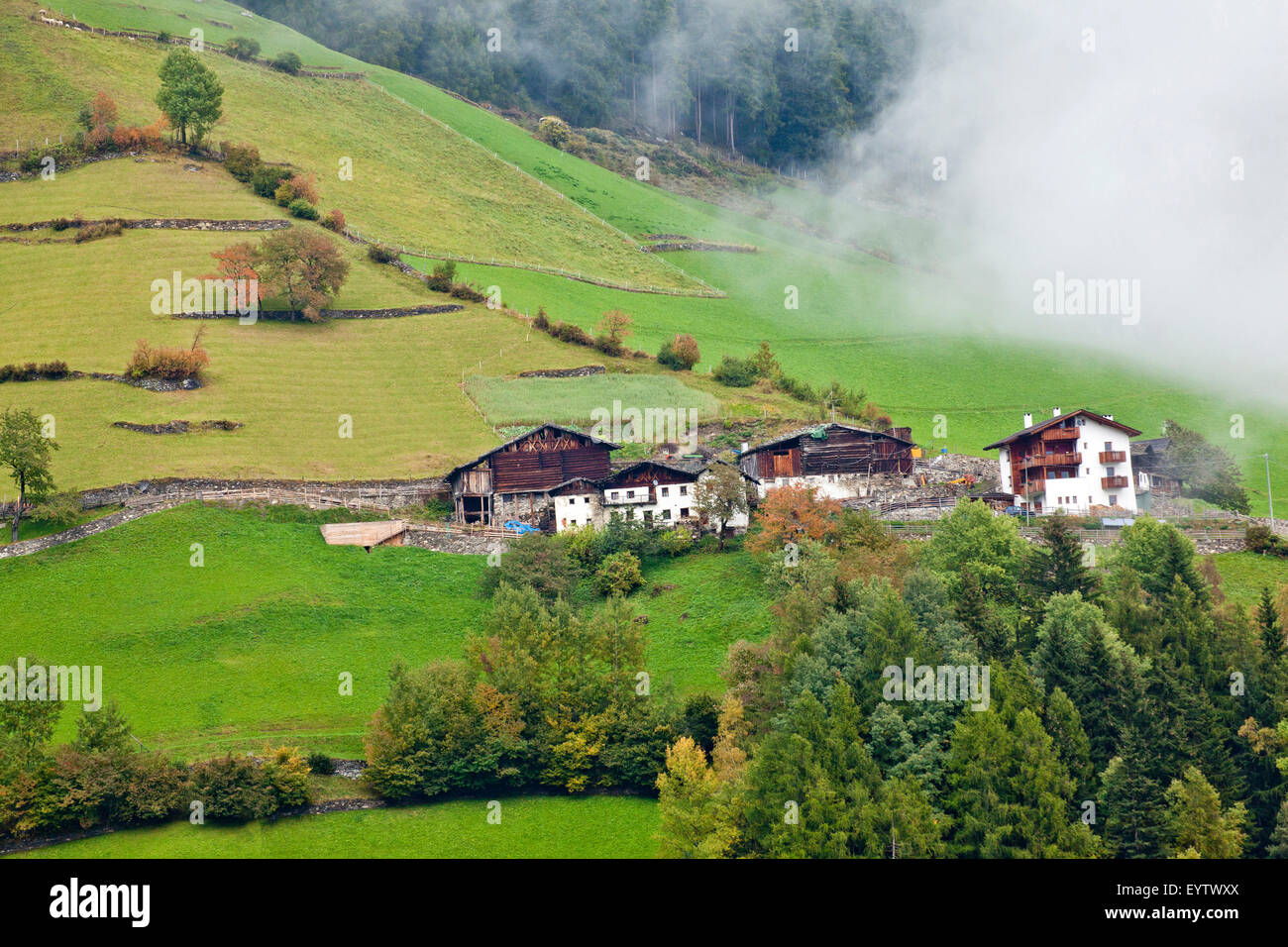 steep mountain pastures with farm Stock Photo - Alamy