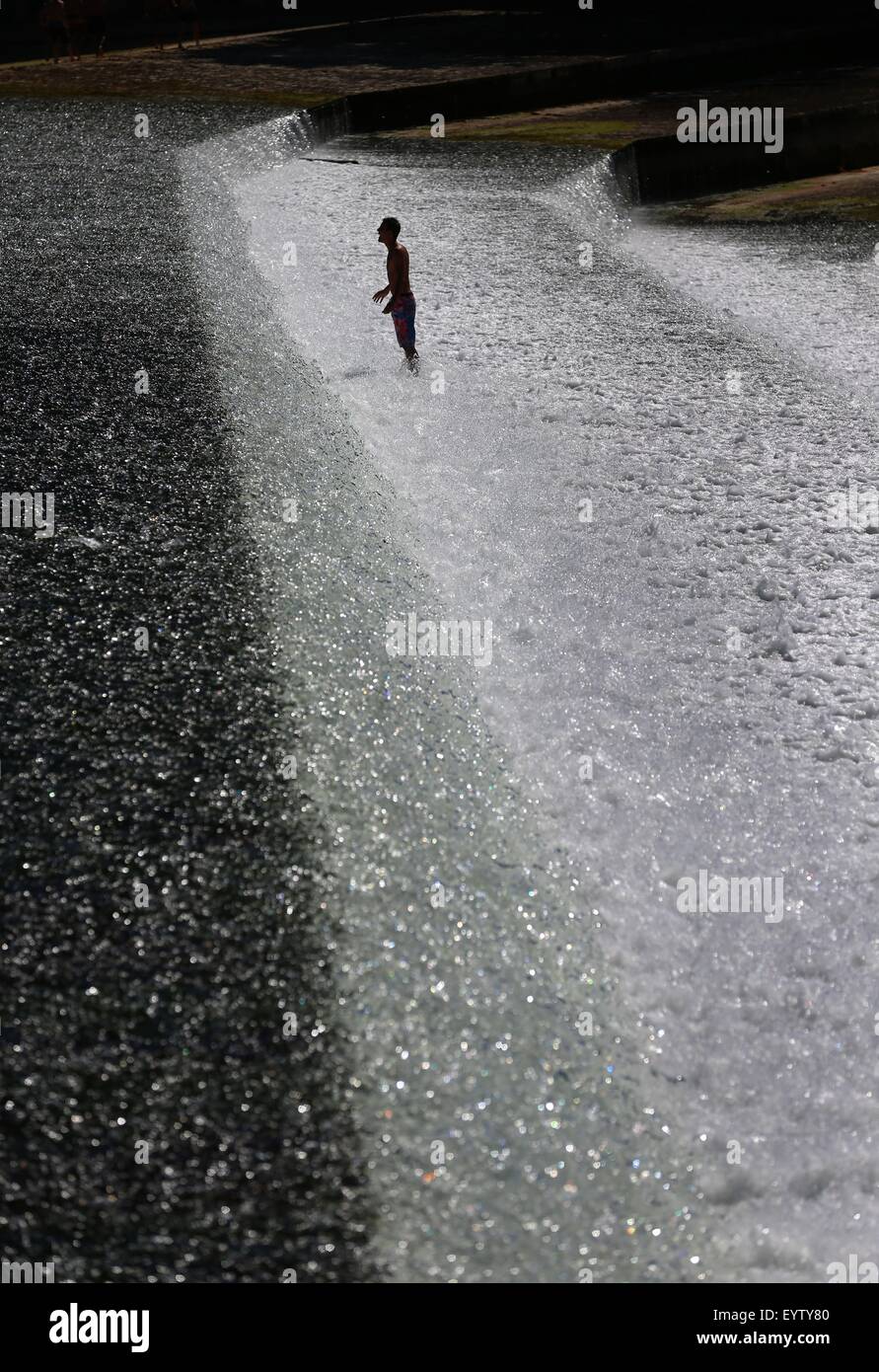 Lech, Germany. 03rd Aug, 2015. A young man seeks relief from the heat ...