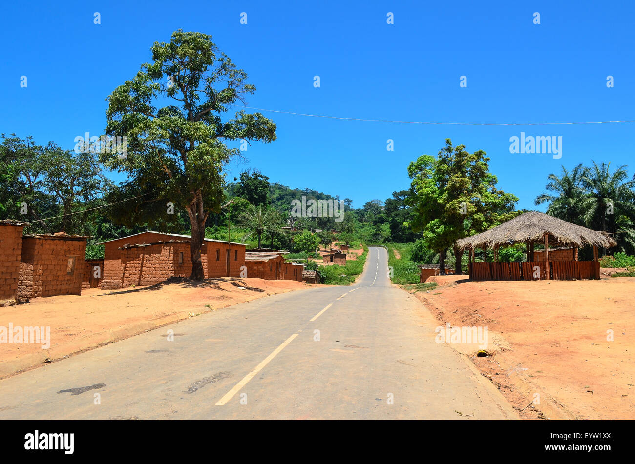 Old tar road crossing villages in rural Angola (Cuanza Norte Stock ...