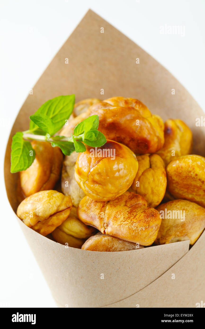 Peeled roasted chestnuts in a paper cone Stock Photo - Alamy