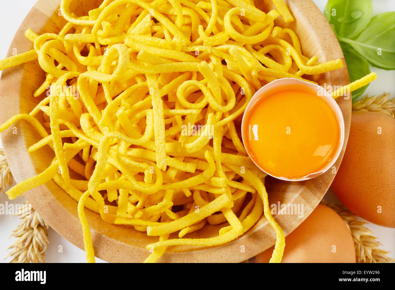 Thin spaetzle in a wooden bowl Stock Photo - Alamy