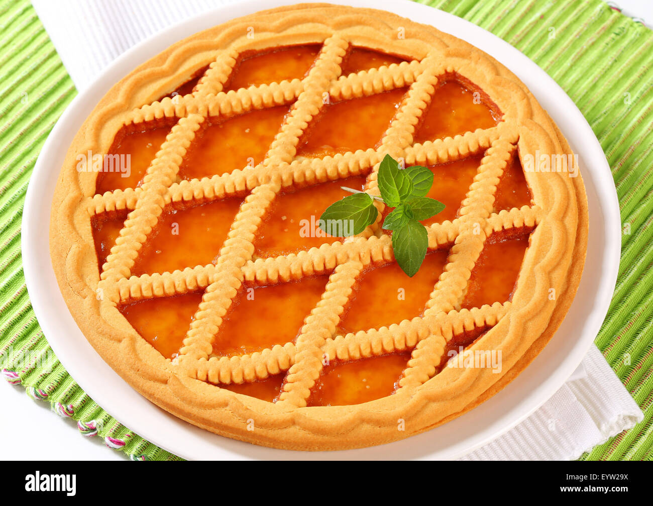 Round lattice topped apricot tart Stock Photo - Alamy