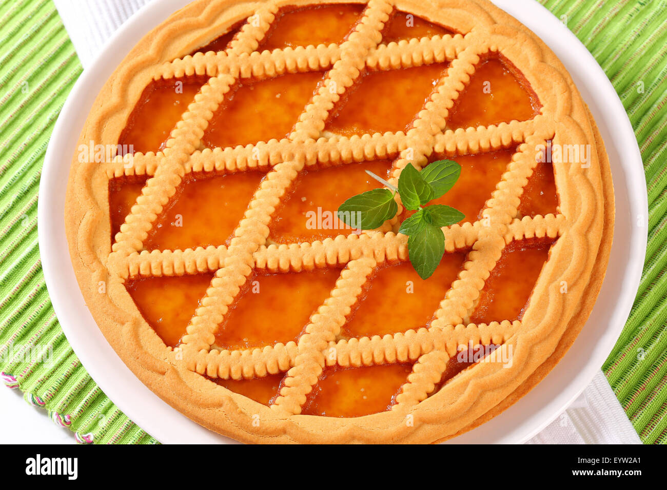 Round lattice topped apricot tart Stock Photo - Alamy