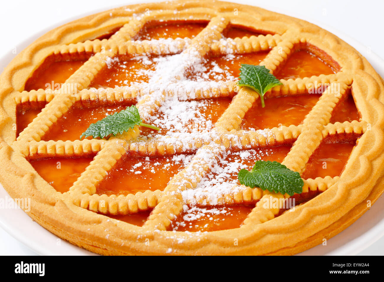 Round lattice topped apricot tart Stock Photo - Alamy