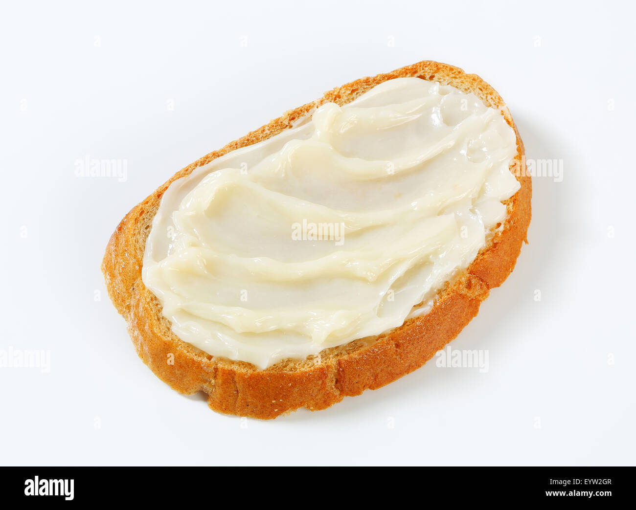 Slice of bread spread with lard Stock Photo - Alamy